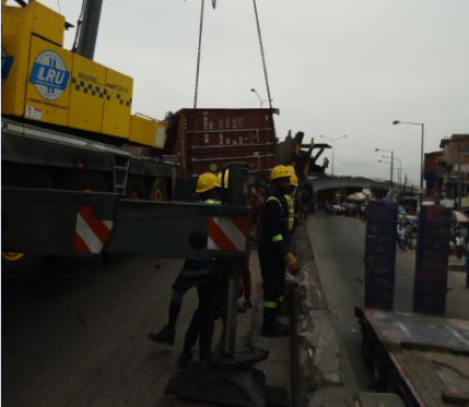 PHOTOS: Commuters stranded as another container falls on Ojuelegba ...